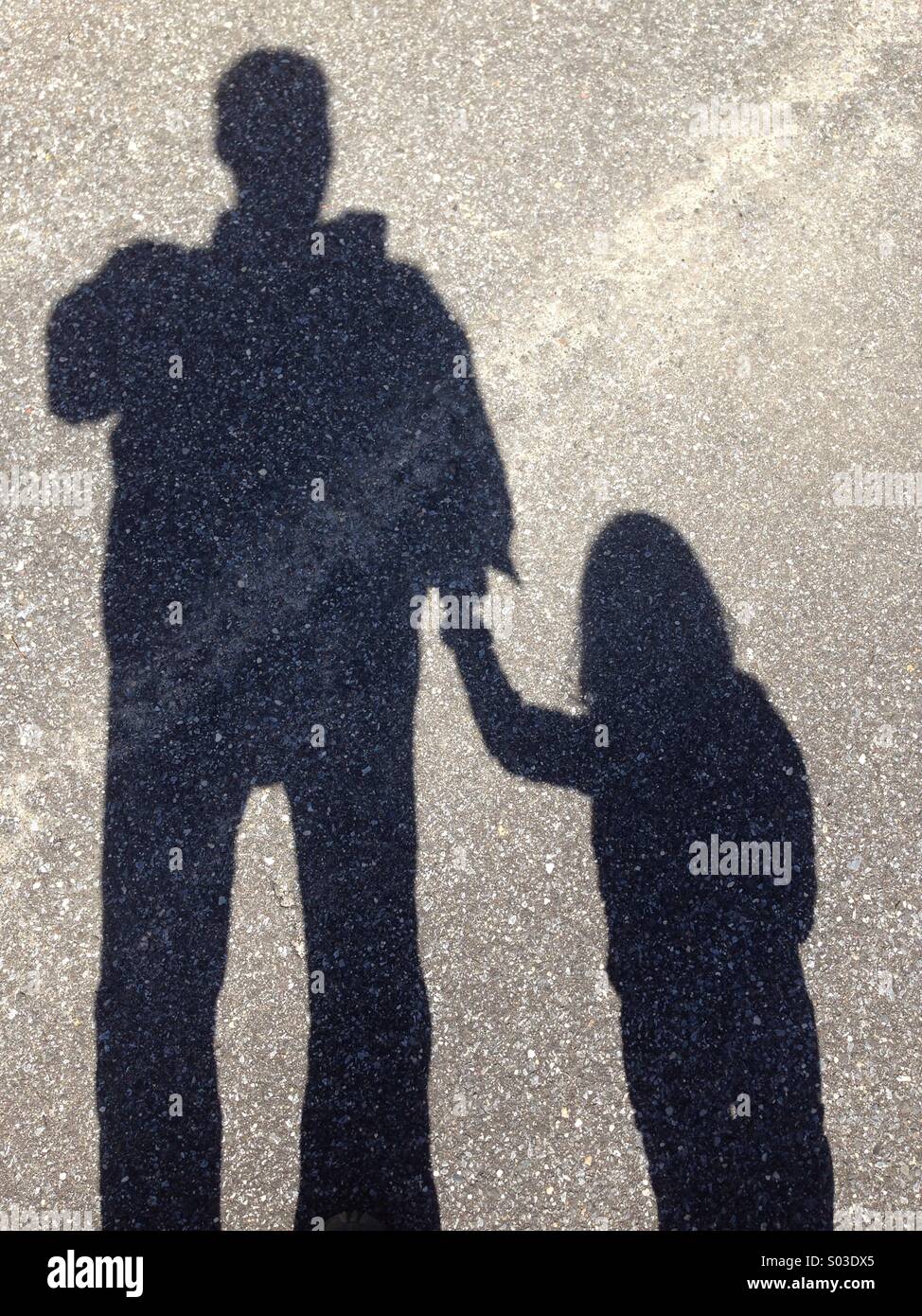 Father daughter holding hands shadow hi-res stock photography and ...