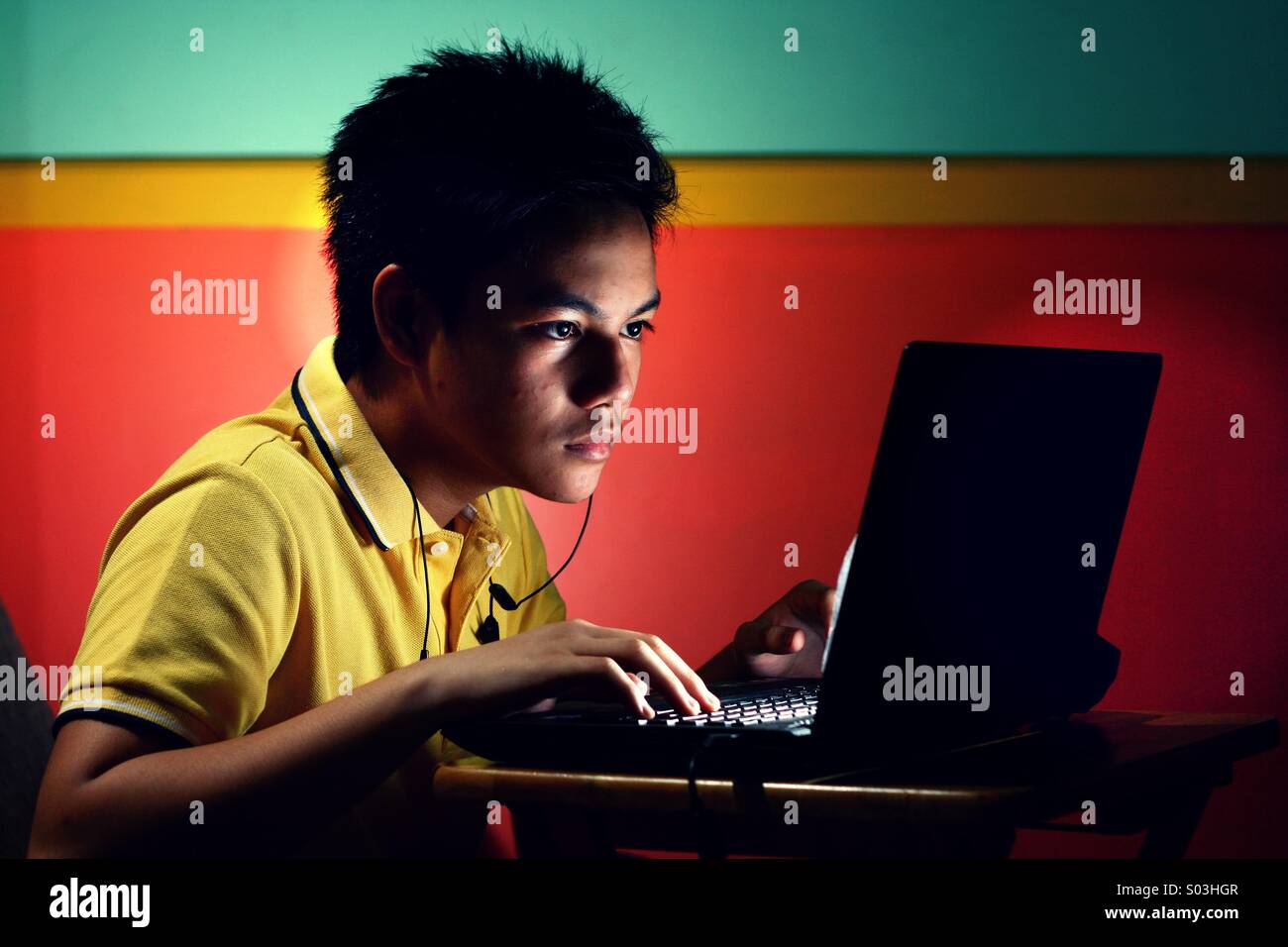 Teen boy studying on laptop hi-res stock photography and images - Alamy
