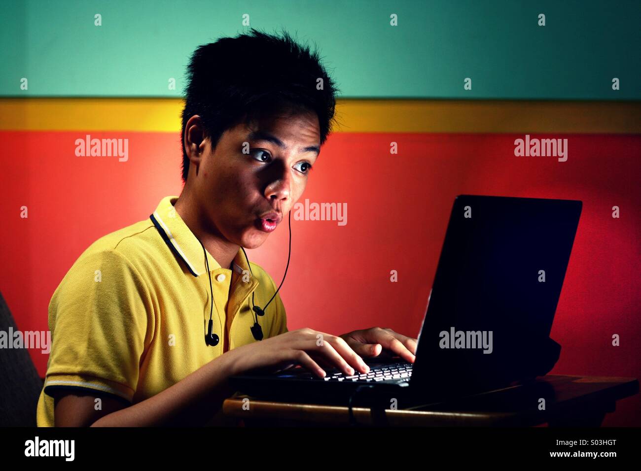 Teen boy studying on laptop hi-res stock photography and images - Alamy