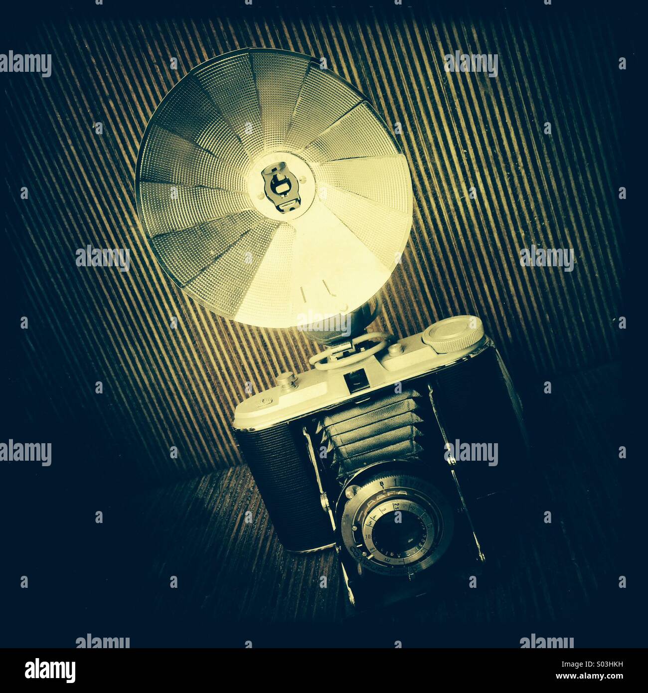 Vintage film folding camera with flash Stock Photo - Alamy