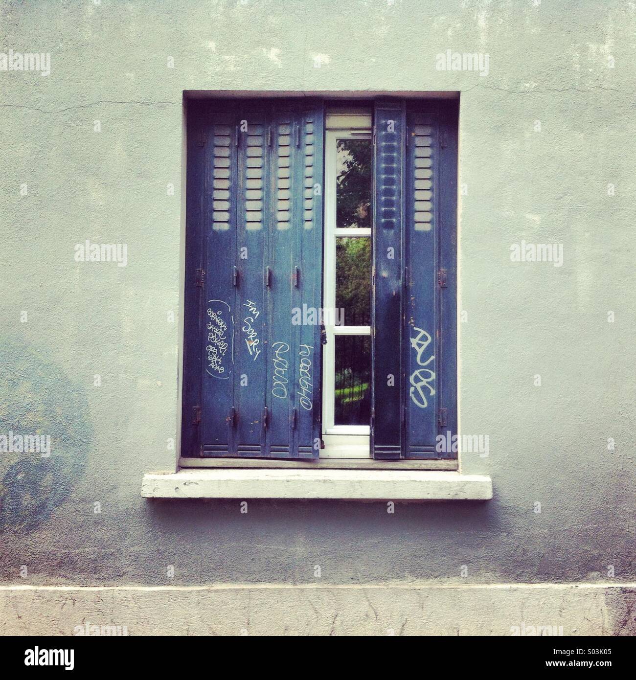 A Parisian blue window with a green reflection in Paris France Stock ...