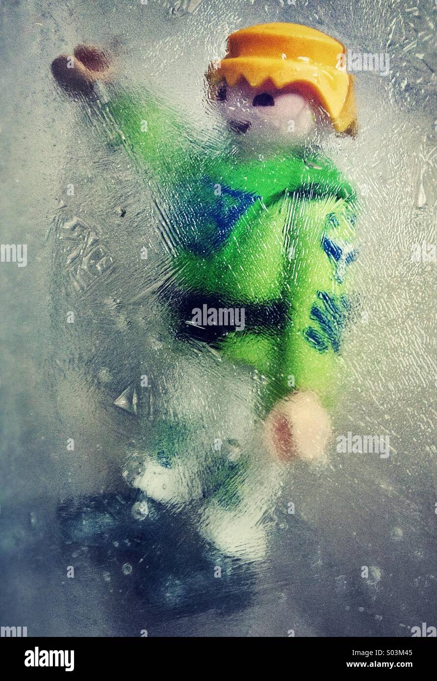 Frozen playmobil toy on cold water Stock Photo - Alamy