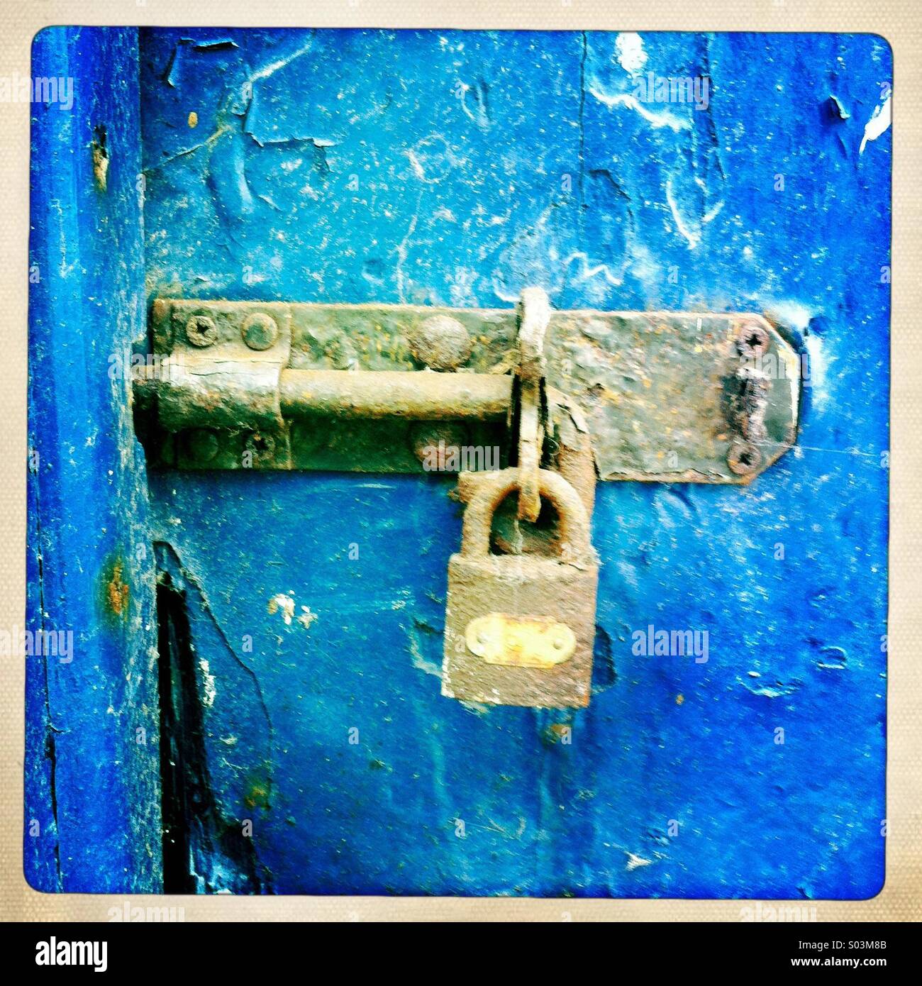 Padlock and bolted gate Stock Photo - Alamy