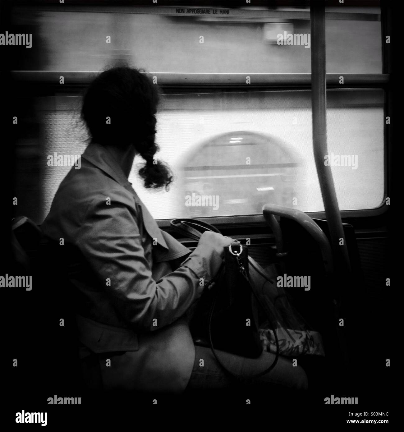 Tram window travelling girl looking out the window watching outside ...