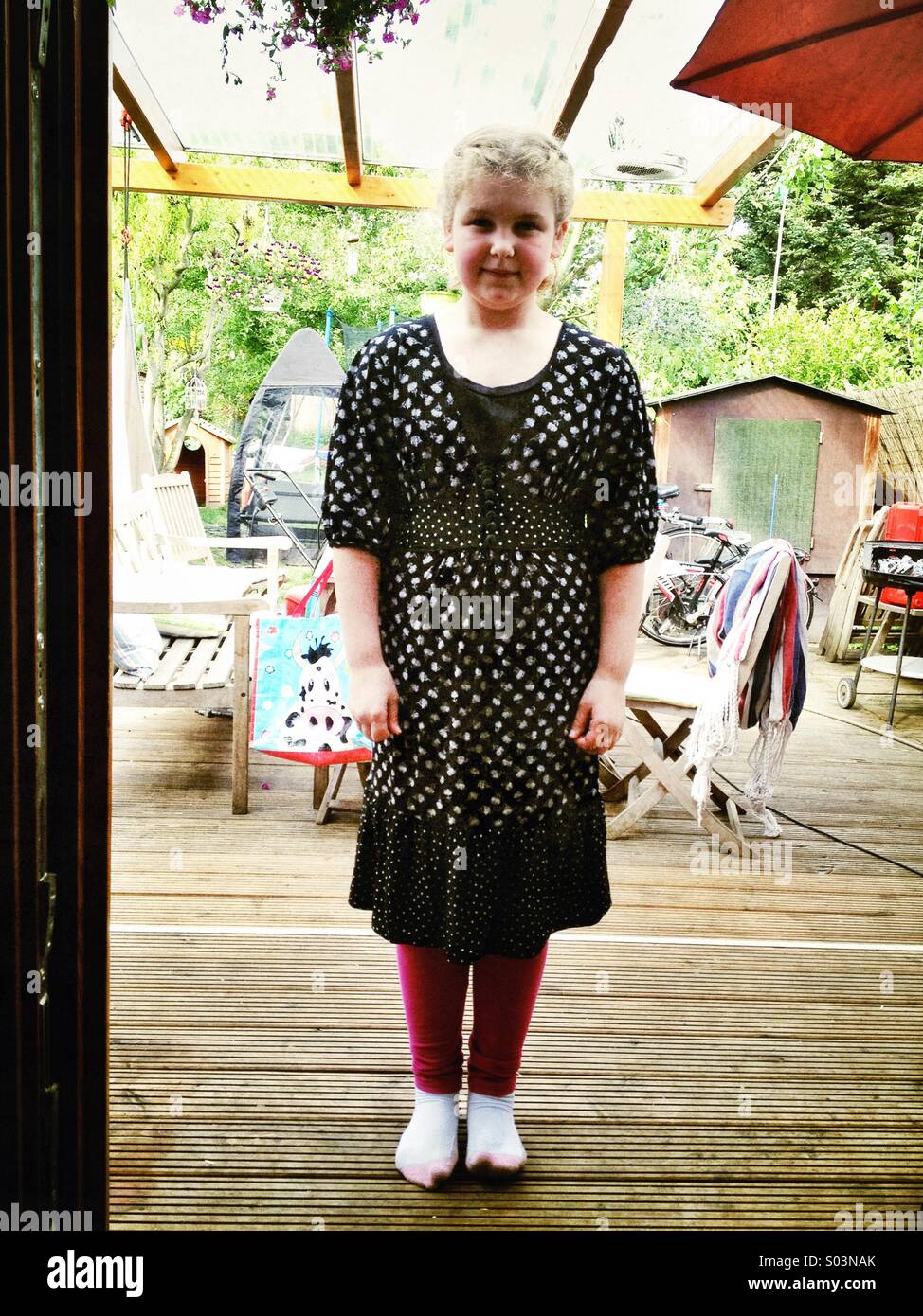 Young girl in yard Stock Photo - Alamy