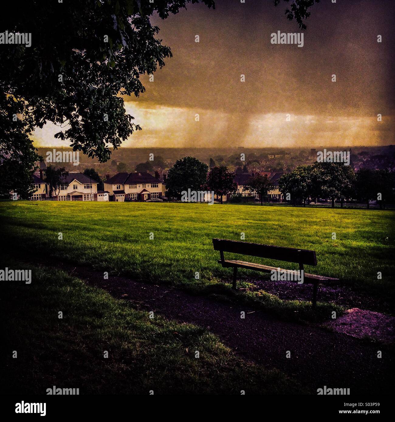 Rain approaching in suburban park SW London Stock Photo - Alamy