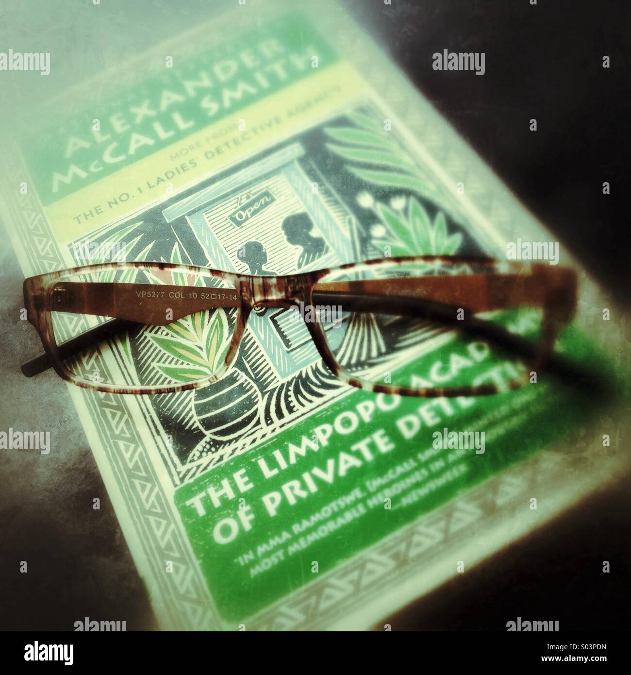 Novel and reading glasses Stock Photo - Alamy