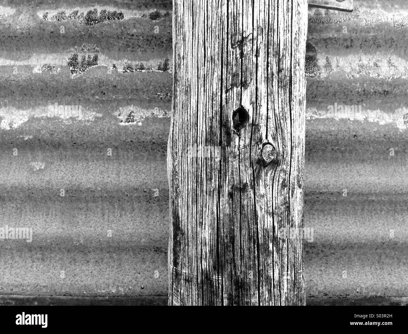 Ageing wood post and rusty iron fence Stock Photo - Alamy