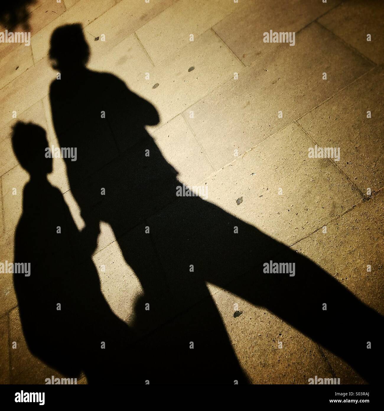 Shadow of mother and child walking on the street in Barcelona Stock ...