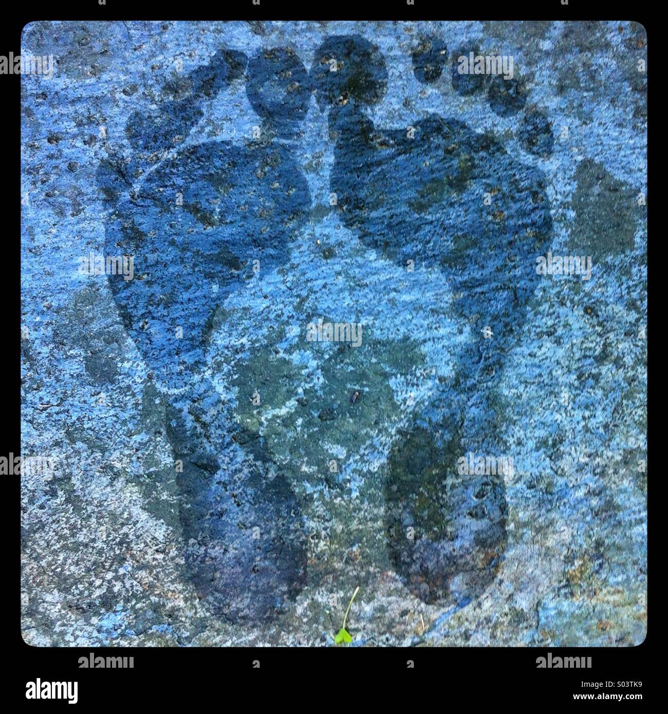 Wet footprints on a stone slab Stock Photo - Alamy