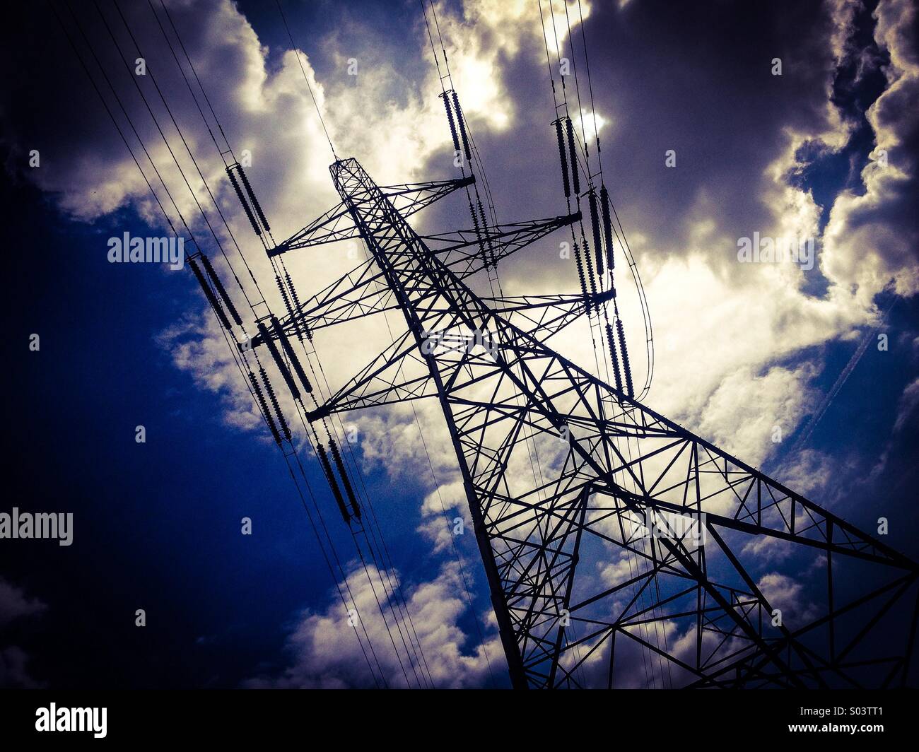 Looking up to electricity pylon to blue sky with clouds Stock Photo - Alamy