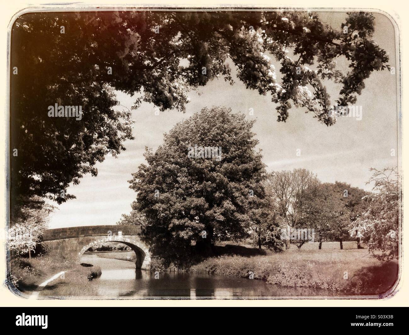 Stone bridge over Leeds Liverpool canal at Adlington in Lancashire ...