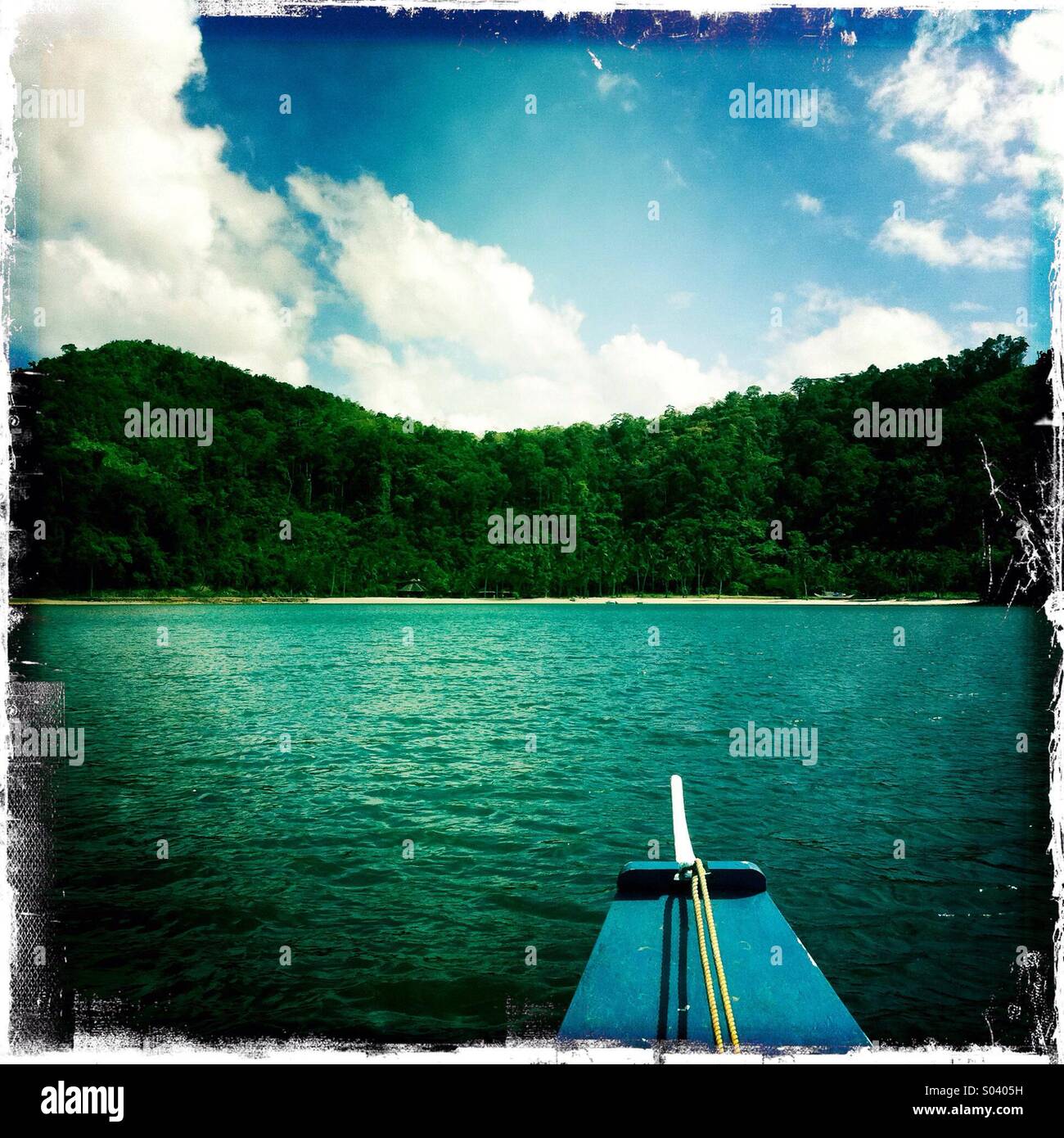 Boat approaching remote beach, Palawan, Philippines Stock Photo - Alamy