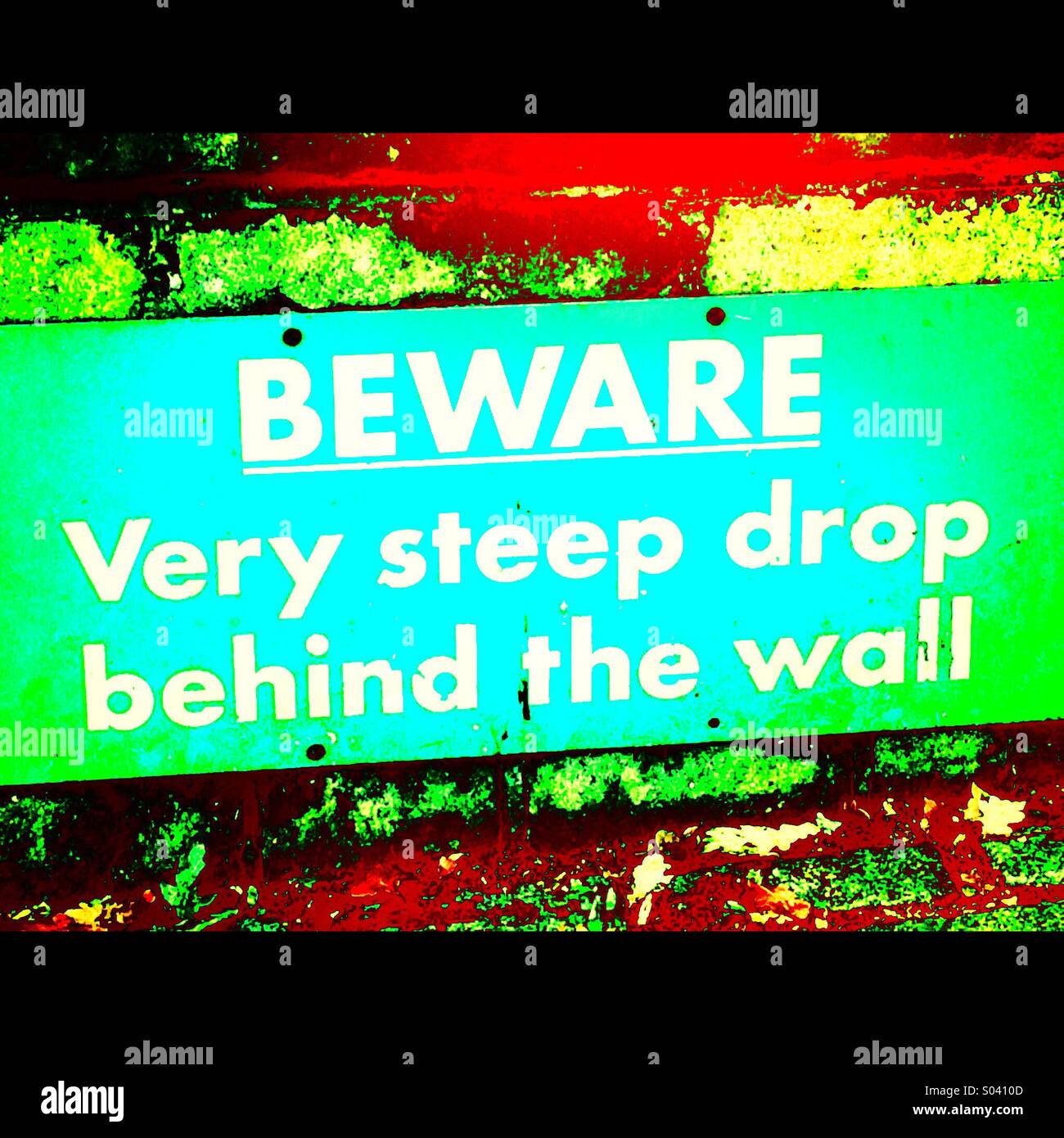 Danger steep drop sign on wall Stock Photo - Alamy