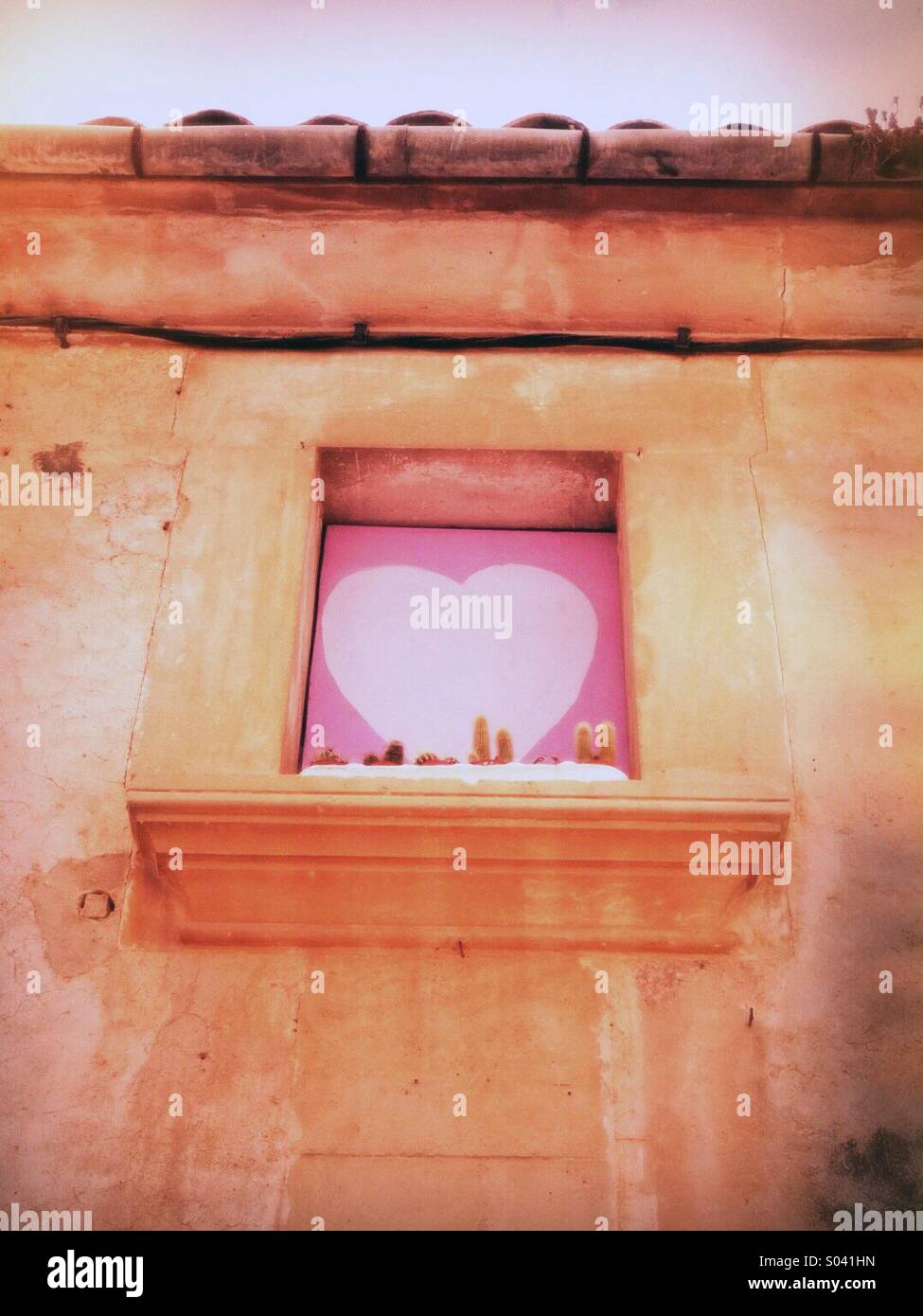 Heart decorated window Stock Photo - Alamy