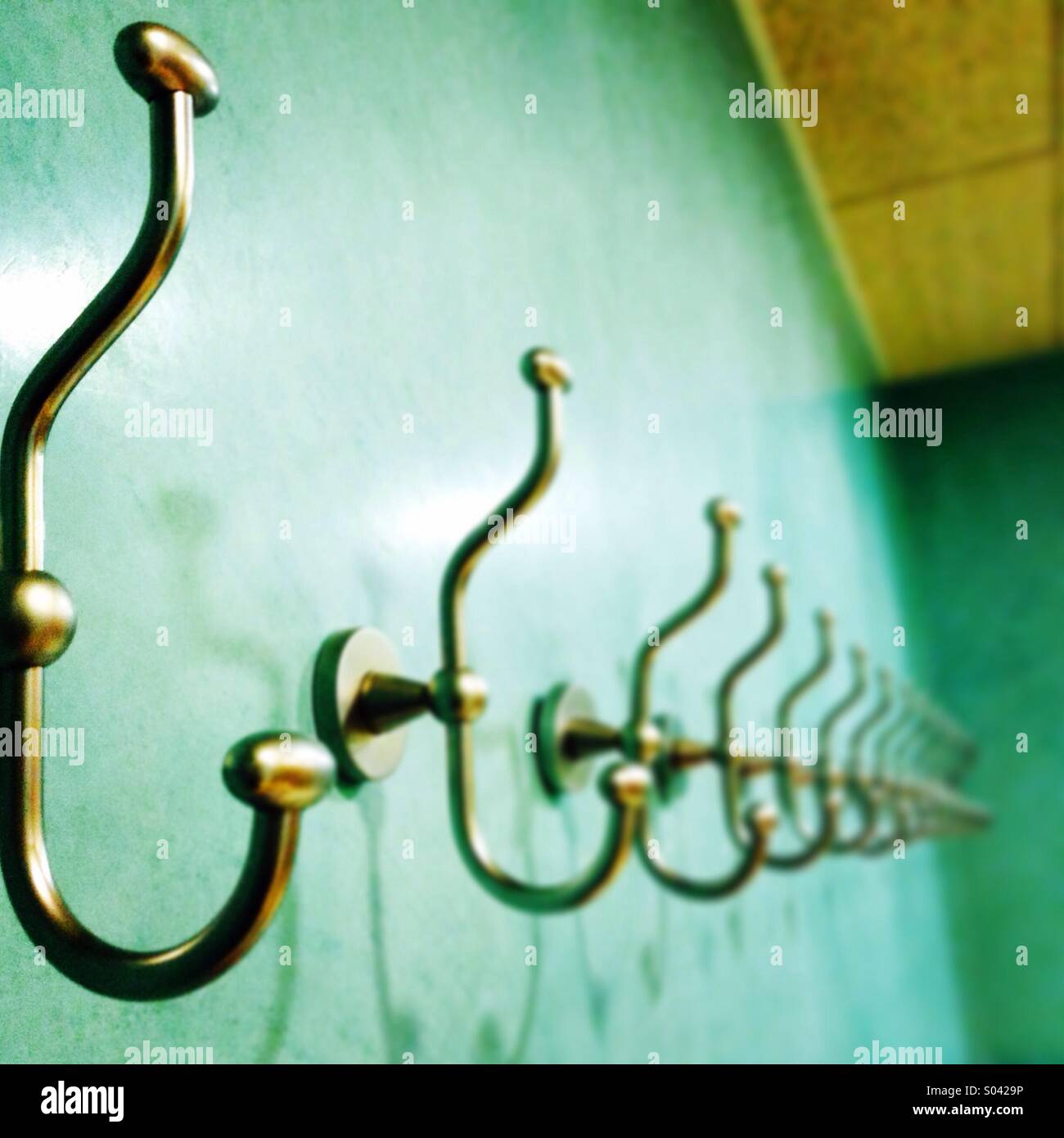 Row of hooks hi-res stock photography and images - Alamy