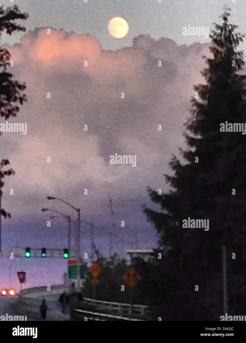 Moonrise in the city Stock Photo - Alamy