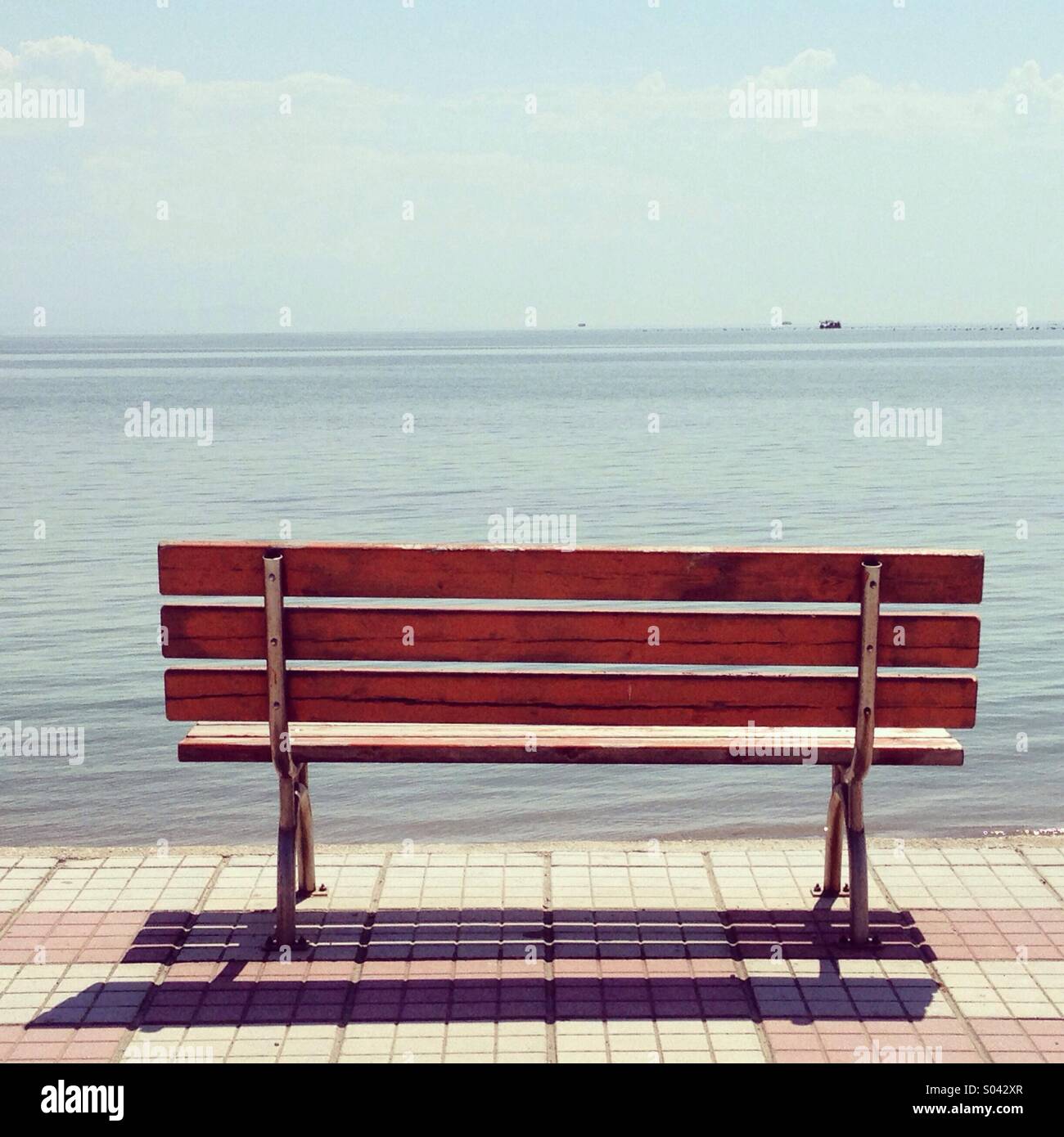 Bench and sea Stock Photo - Alamy
