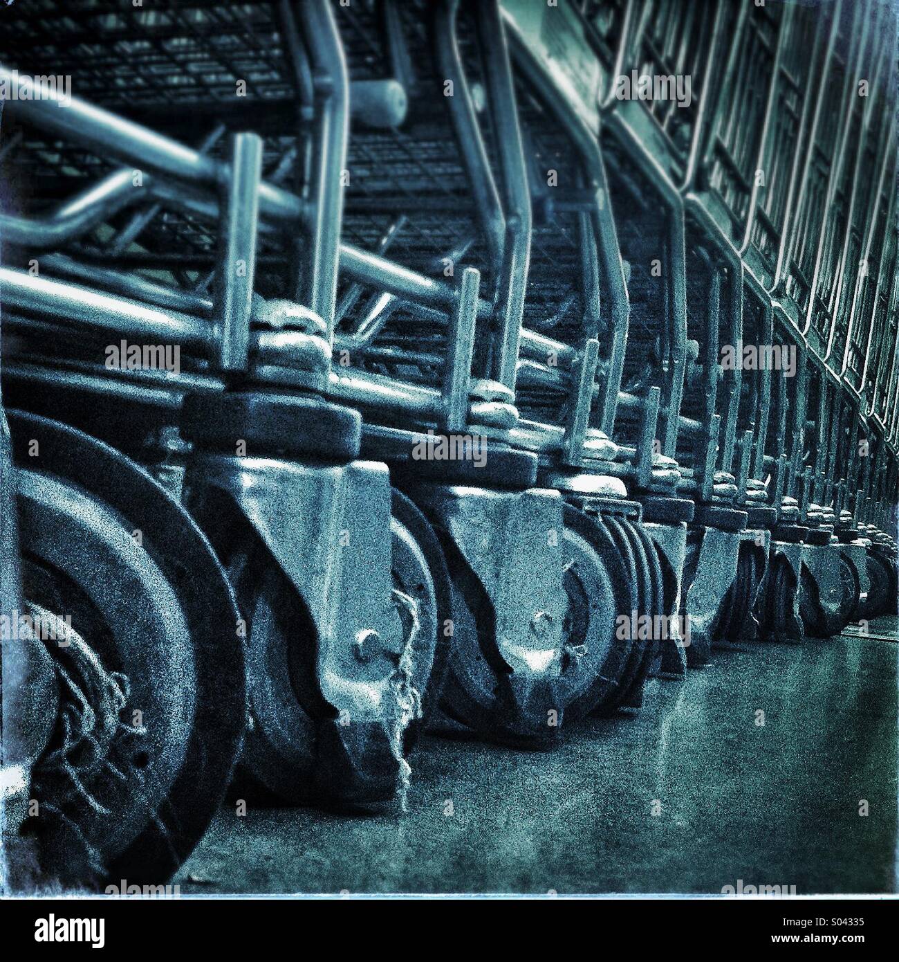 Stacked supermarket shopping carts Stock Photo - Alamy