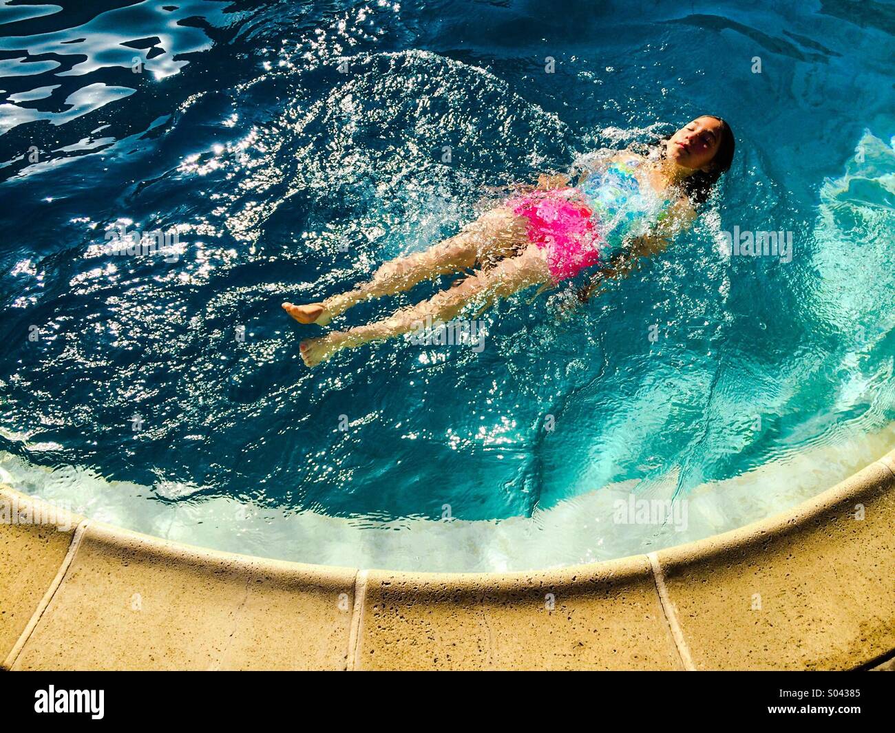 Floating on her back hi-res stock photography and images - Alamy