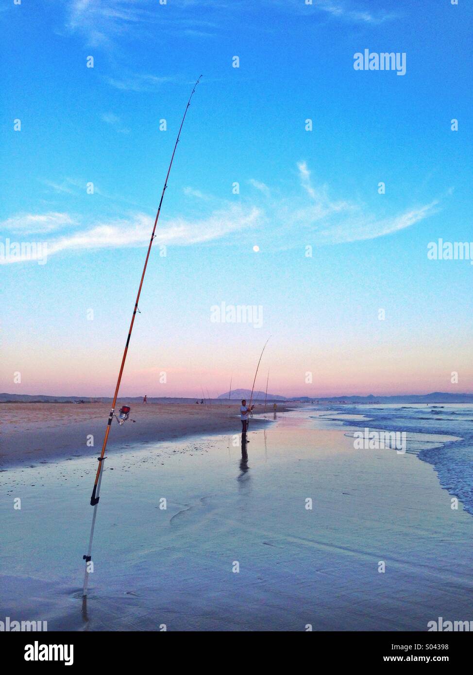 Beach with fishing rod hi-res stock photography and images - Alamy