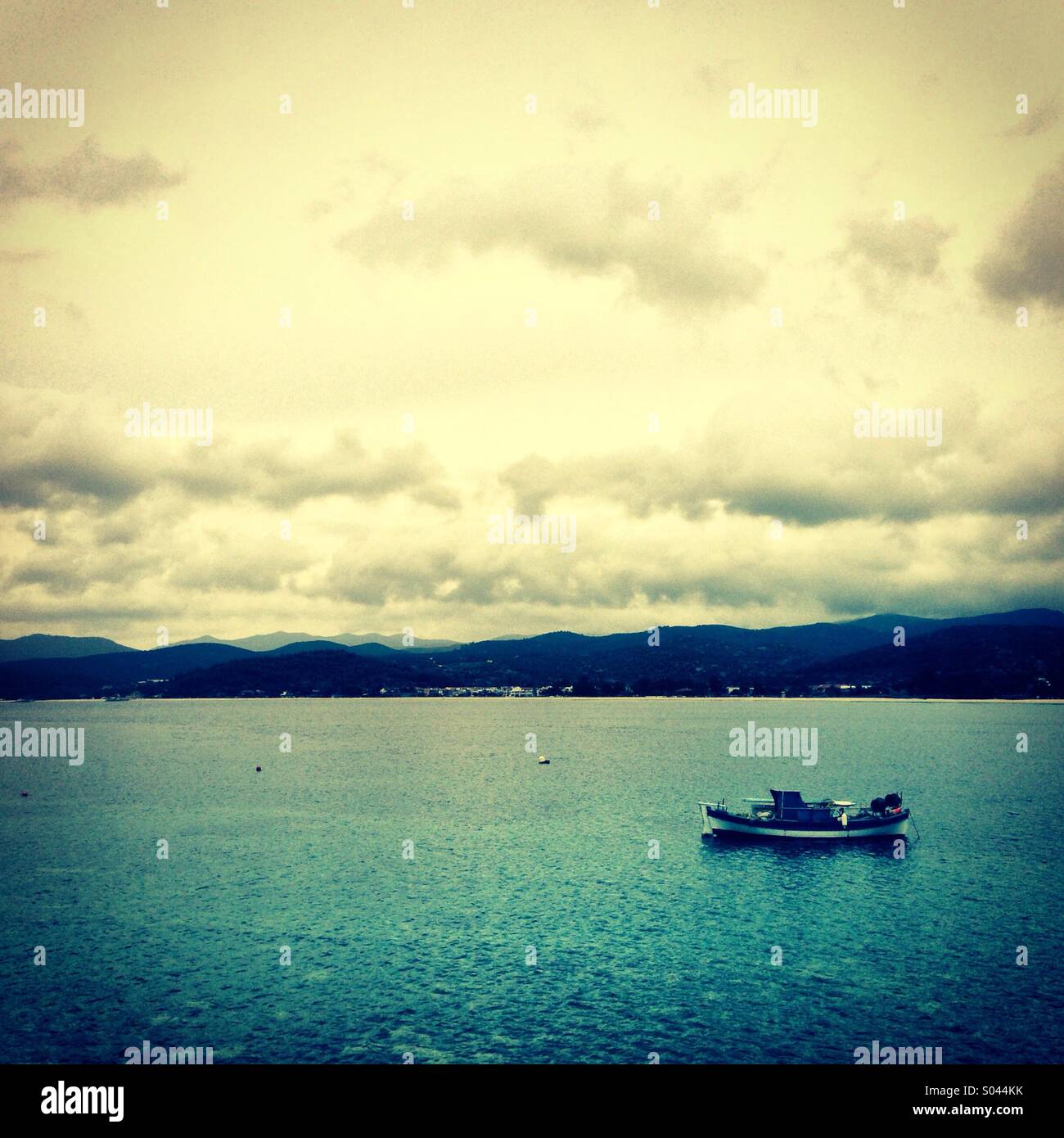 Lonely boat in the sea Stock Photo - Alamy