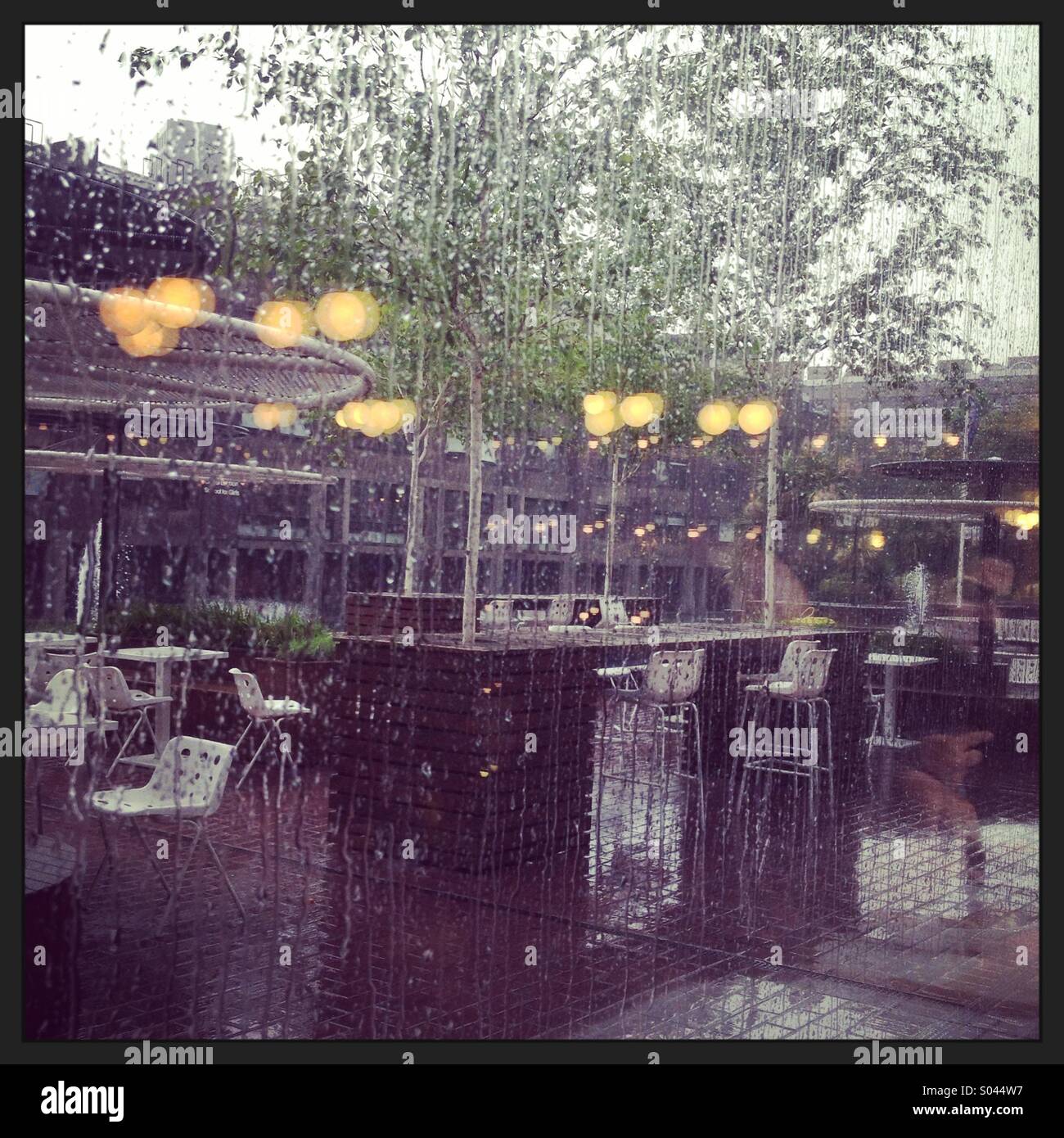 Looking out at rainy London from inside a cafe at the Barbican Stock ...