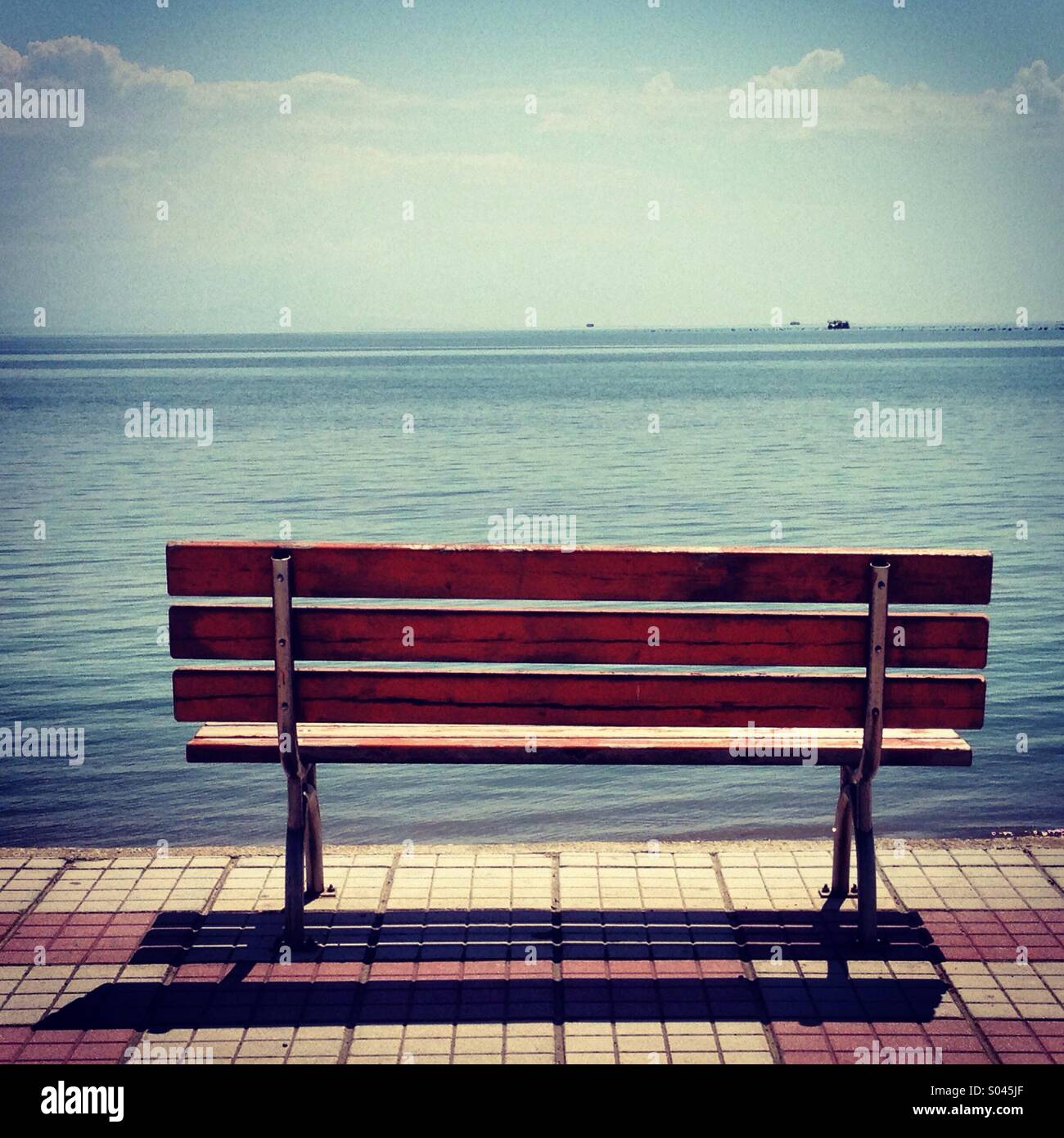 Bench and sea view Stock Photo - Alamy