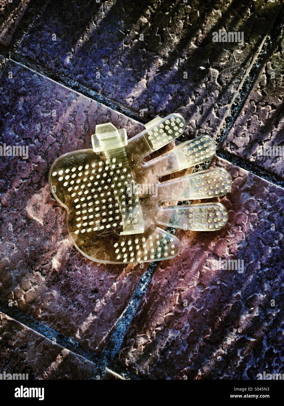 Yellow rubber hand Stock Photo - Alamy