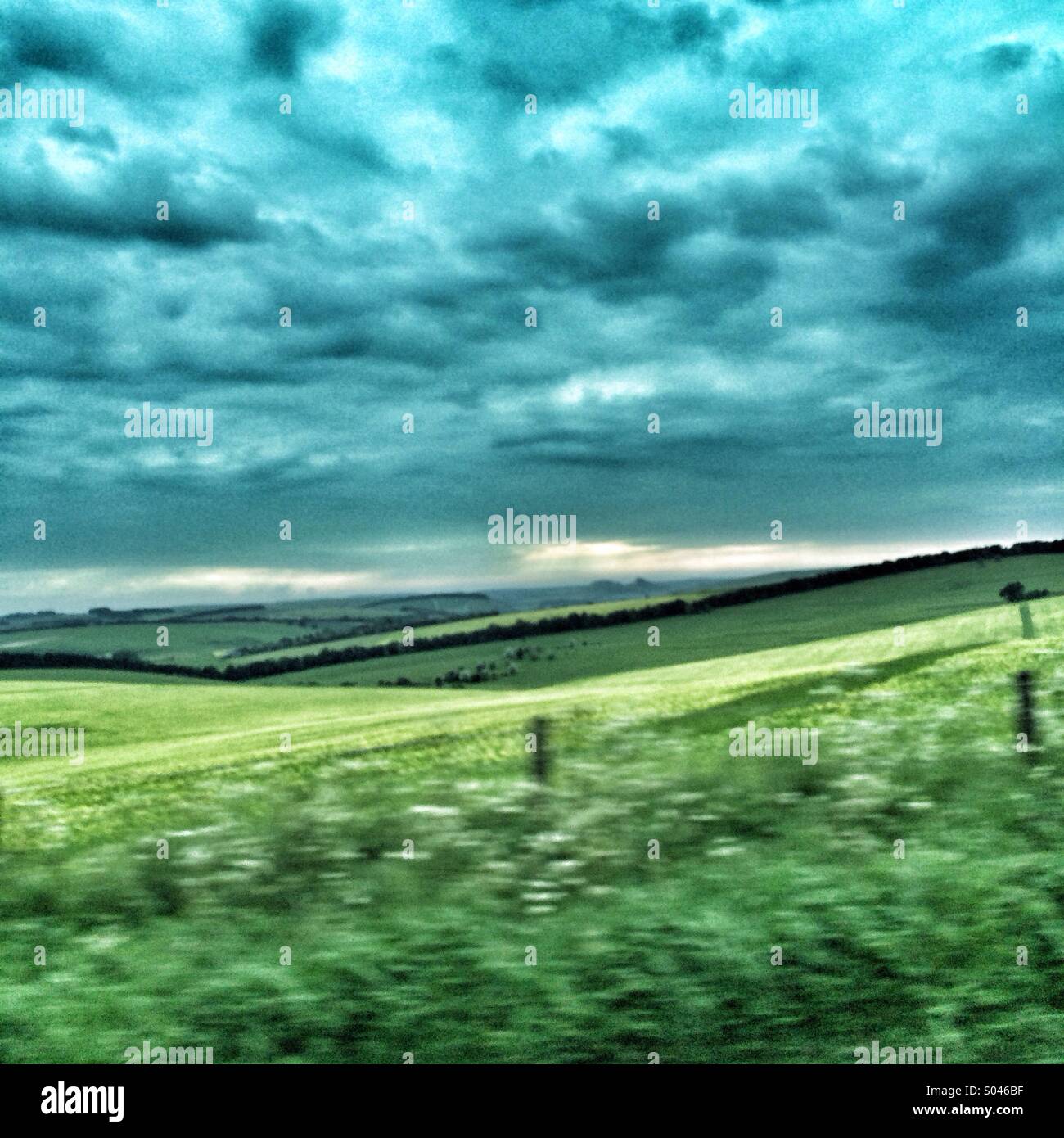 Stormy sky over fields Stock Photo - Alamy