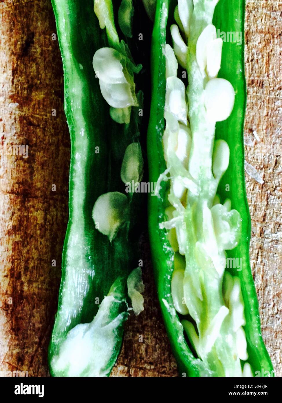 Green chilli pepper cut Stock Photo - Alamy