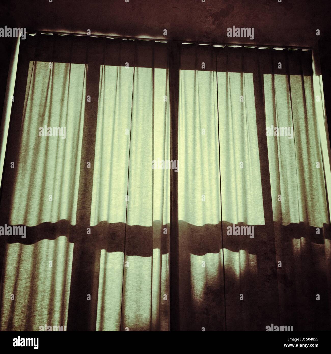 Shadows cast on a set of curtains Stock Photo - Alamy