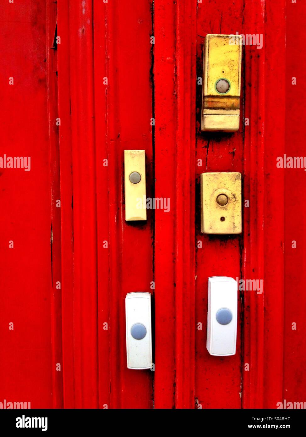 Red door bell pushes Stock Photo - Alamy
