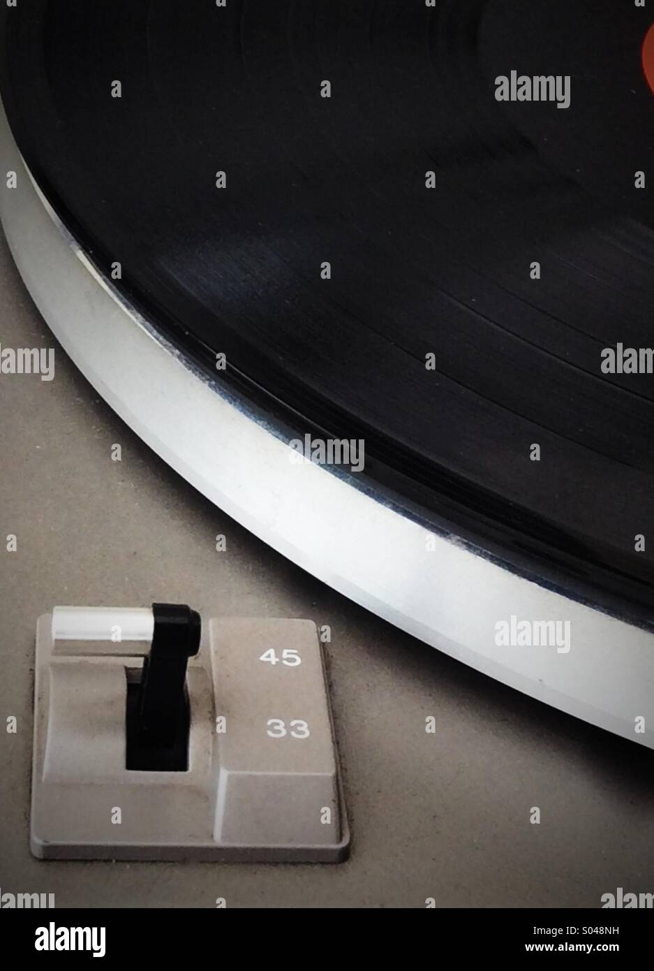 Record deck 33rpm or 45rpm selector switch and LP. Mobile phone photo ...