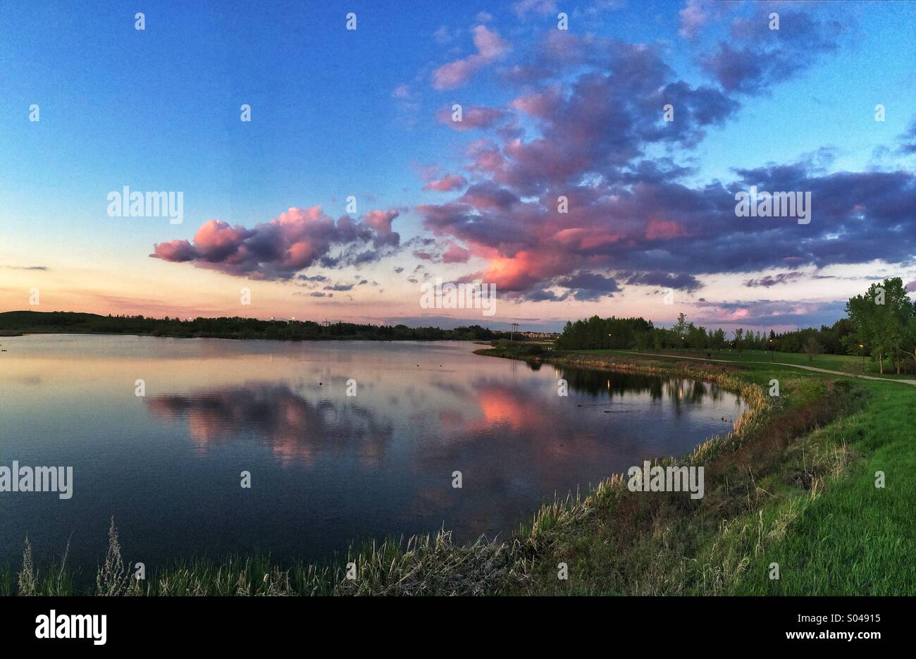 Miniature clouds and their reflection over wascana Stock Photo - Alamy