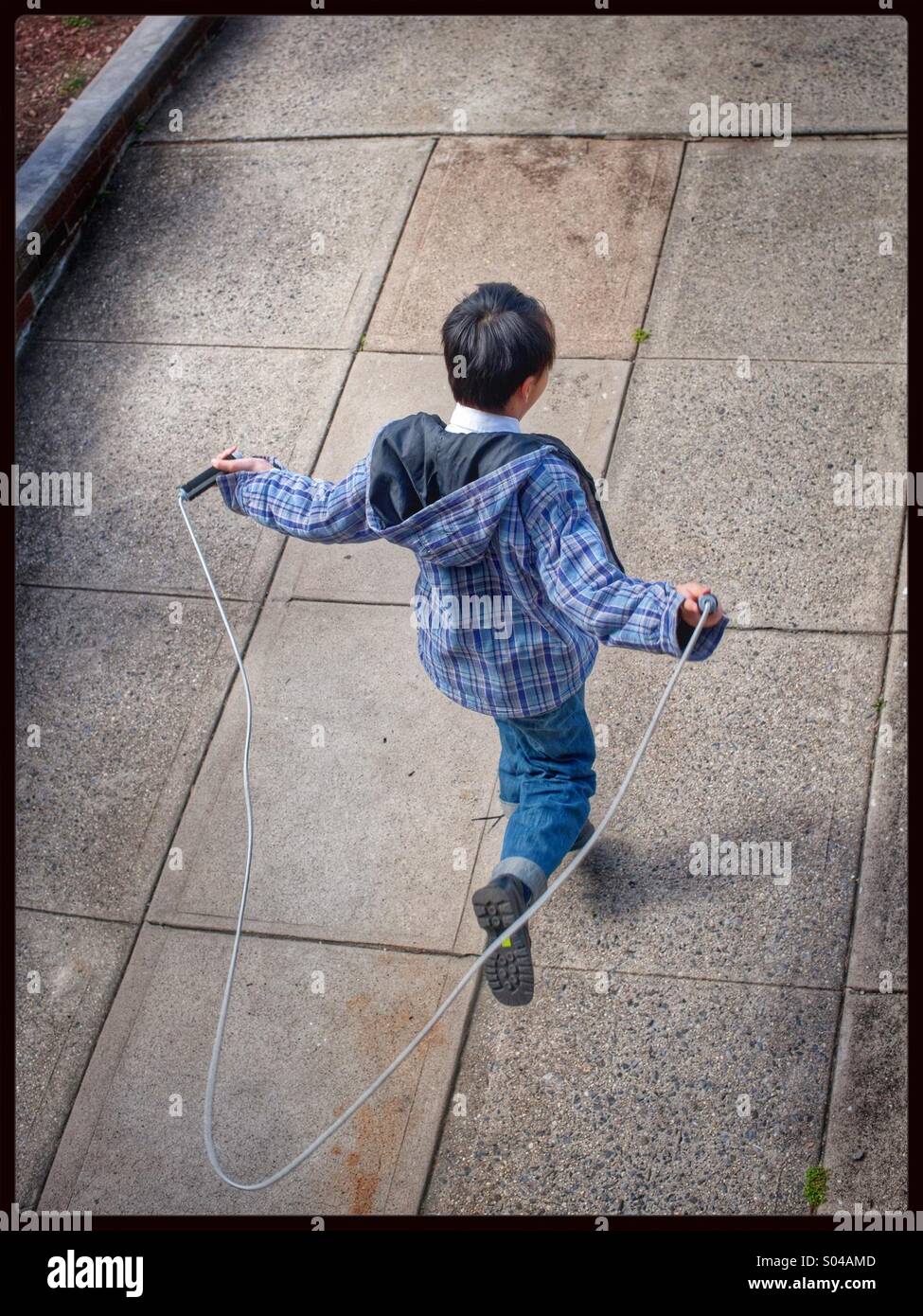 Boy skipping rope hi-res stock photography and images - Alamy