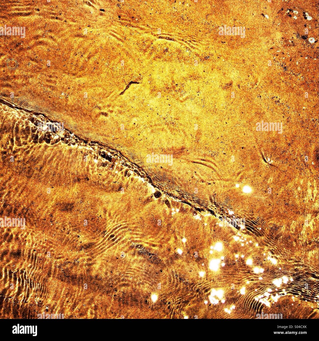 Reflection of sun in sea Stock Photo - Alamy