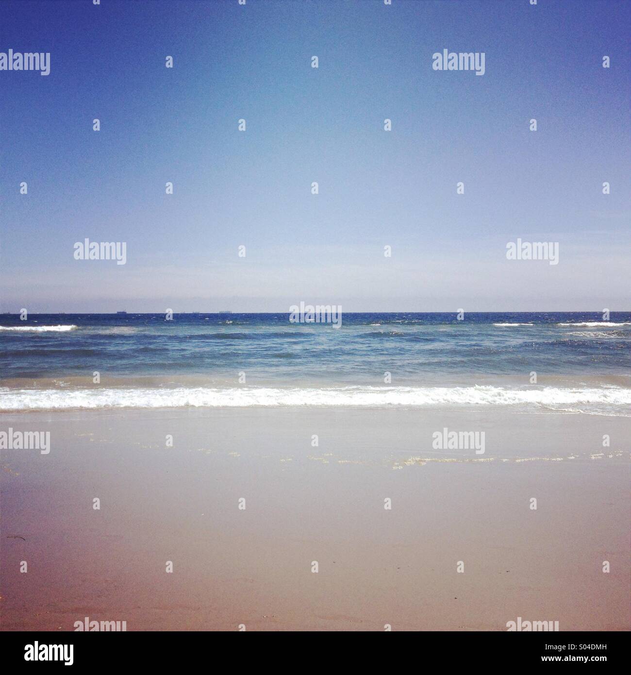 Tide rolling in Stock Photo - Alamy