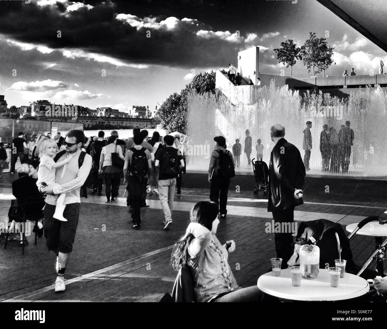 People cool off in a fountain installed outside the Royal Festival Hall ...