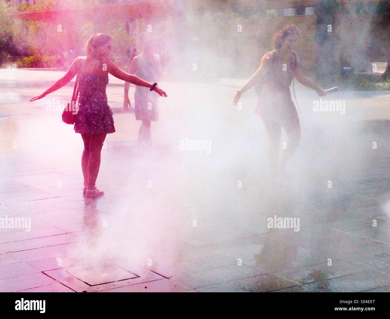 Girls dancing in a mist Stock Photo - Alamy