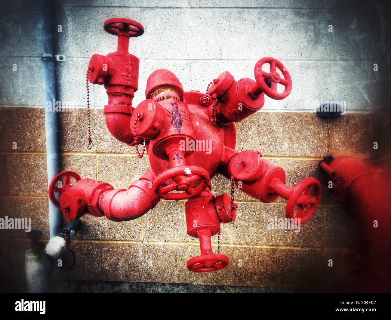 Multiple valve red fire department standpipe outside building Stock ...