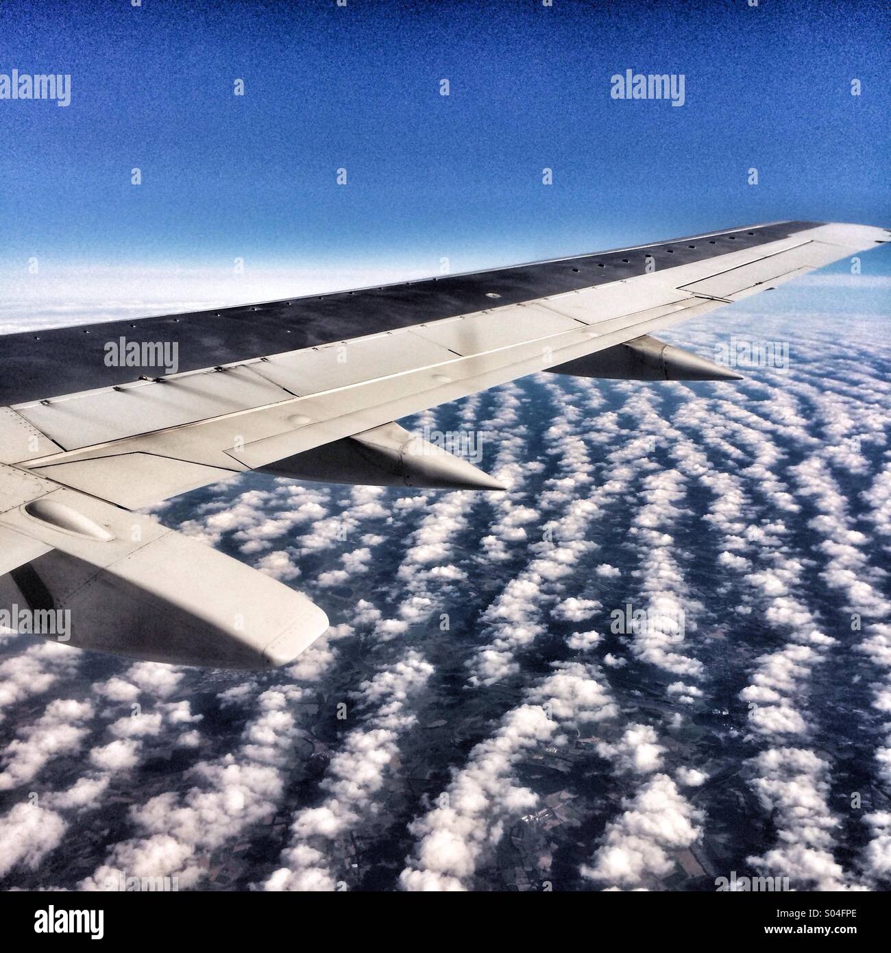 Plane with clouds hi-res stock photography and images - Alamy