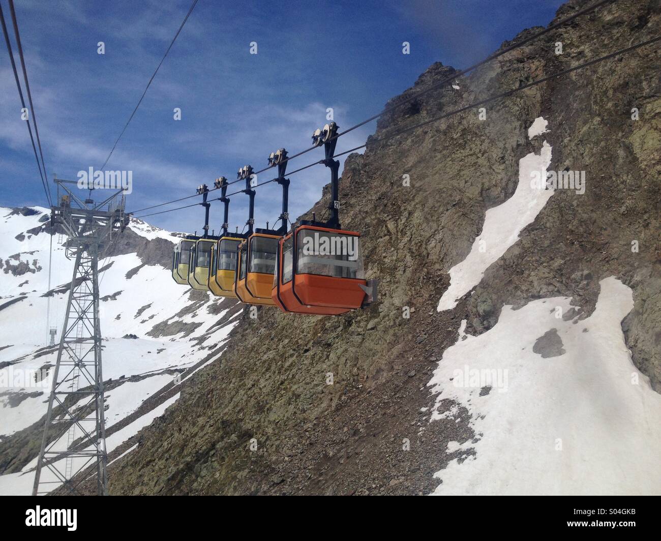 Alpine cable cars going up La Meije Stock Photo - Alamy