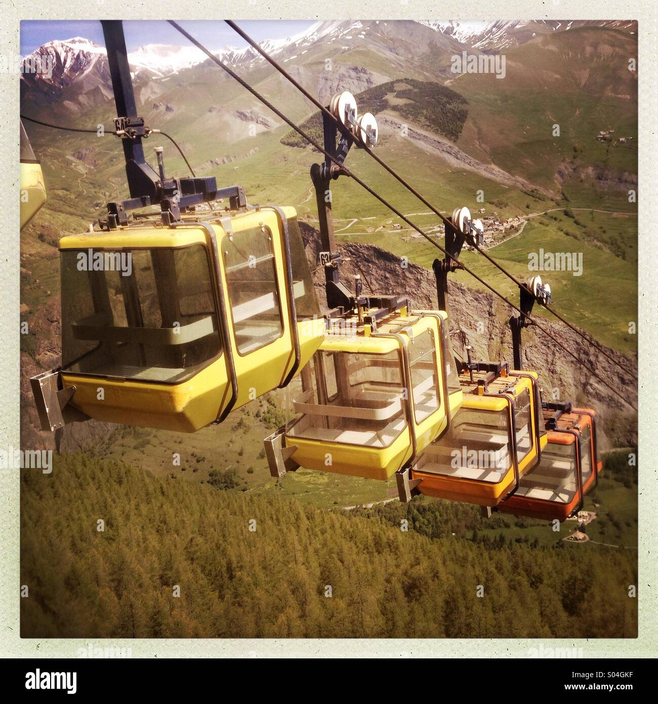 Alpine cable cars going up La Meije Stock Photo - Alamy
