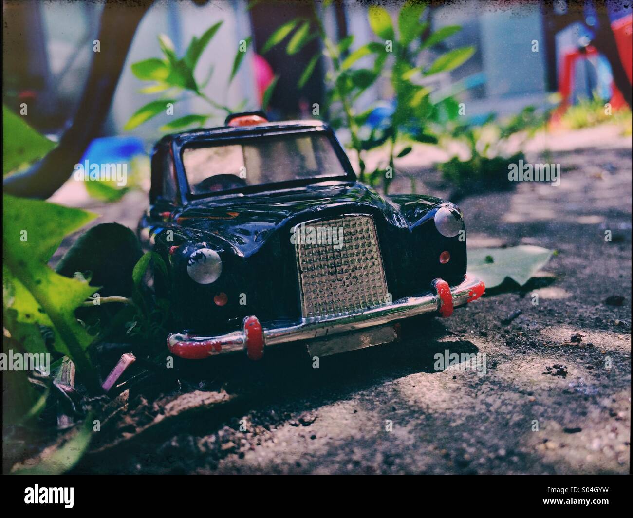 Toy replica of London Black Cab in the sunshine Stock Photo - Alamy
