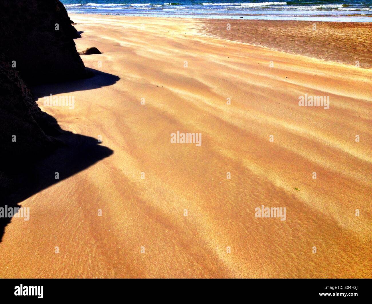 Sand Sea Rocks Stock Photo - Alamy