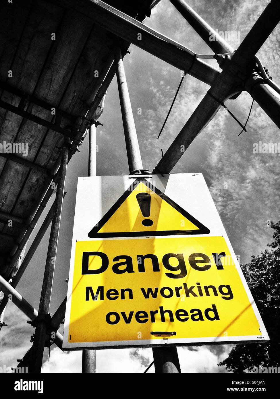 Danger men working overhead sign Stock Photo - Alamy