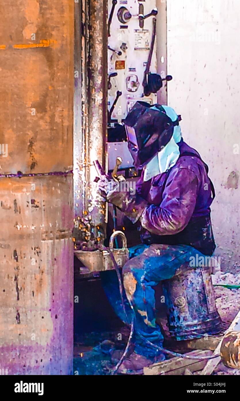 Hot job! Welding well pipe casing Stock Photo - Alamy