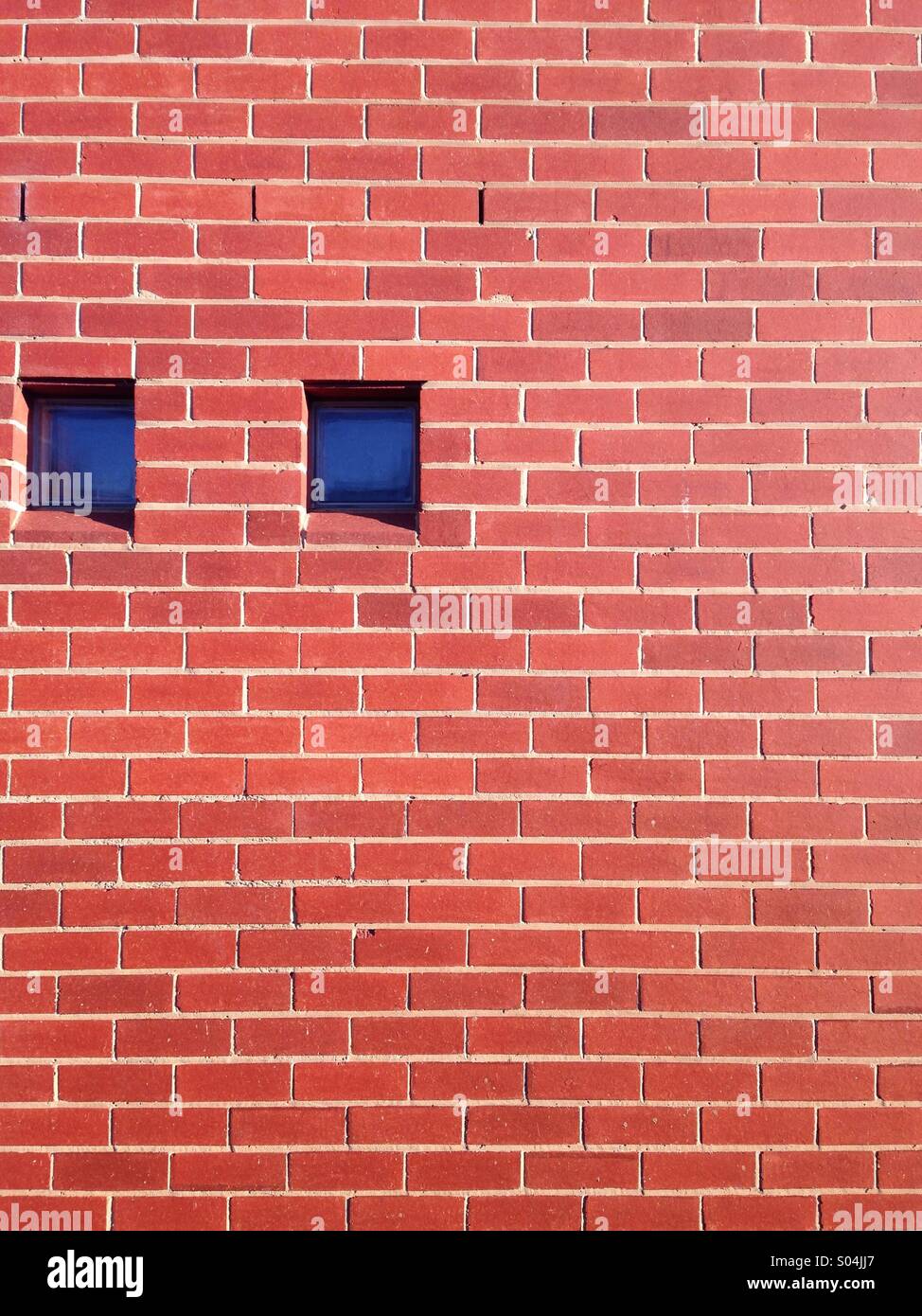 Red Brick Wall and Two Windows Stock Photo - Alamy