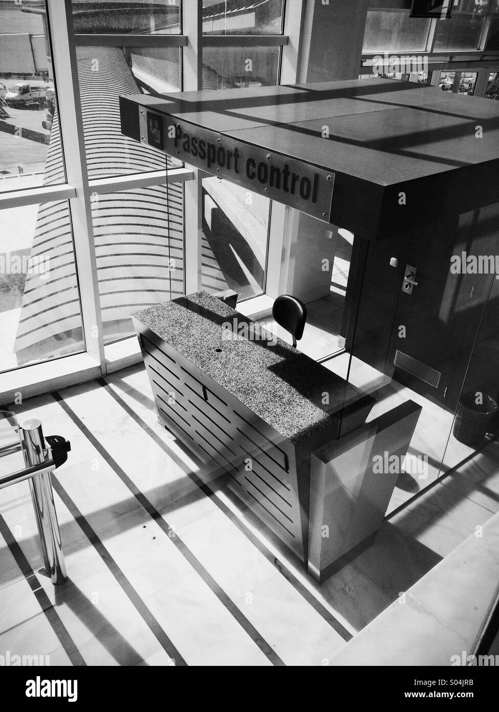 Passport control desk at an airport Stock Photo - Alamy